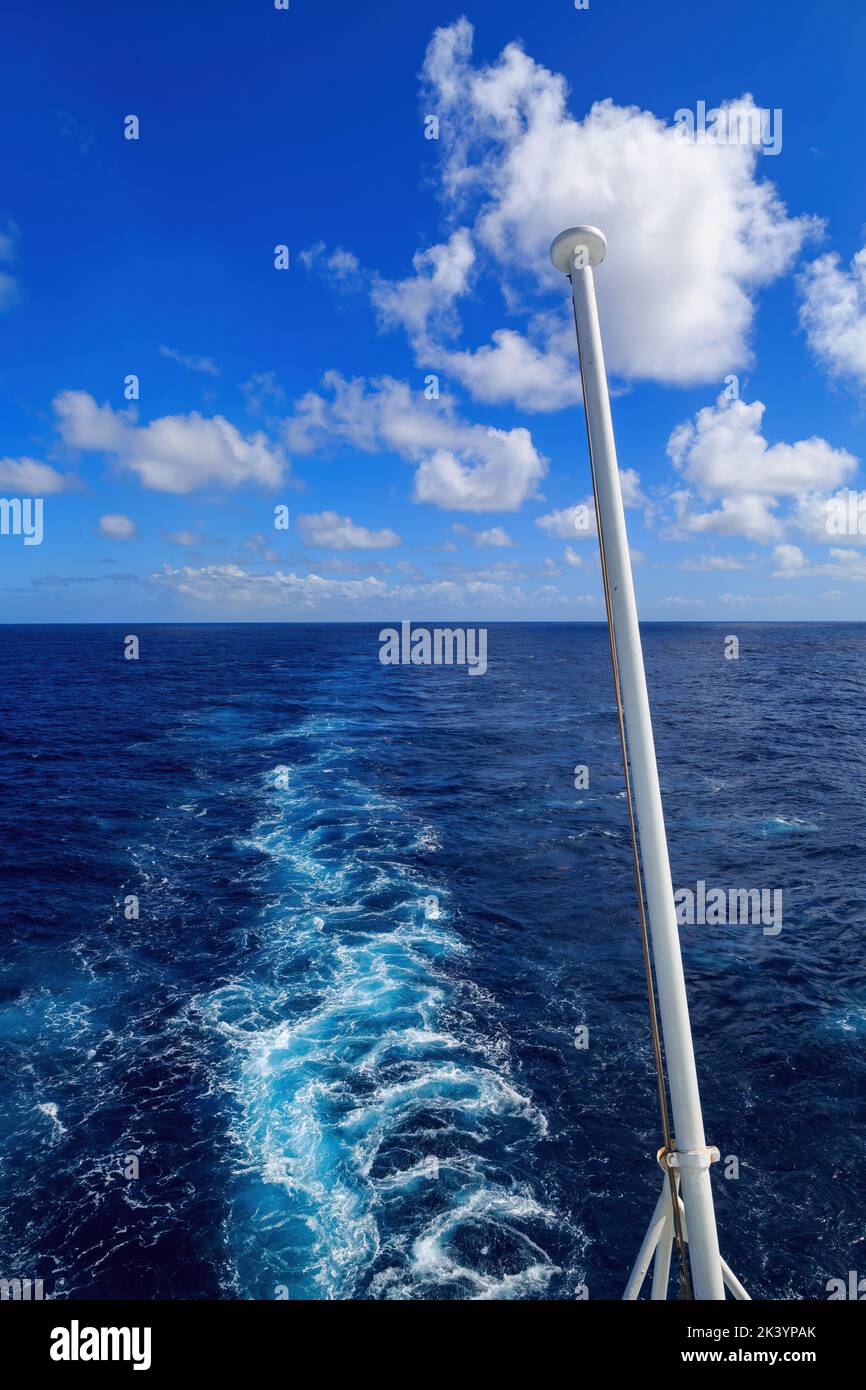 View from the stern flagpole of a cruise ship, showing the ship's wake ...