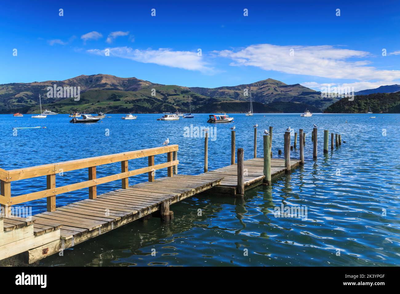 A multi-level wooden pier at Akaroa, New Zealand, designed to allow ...