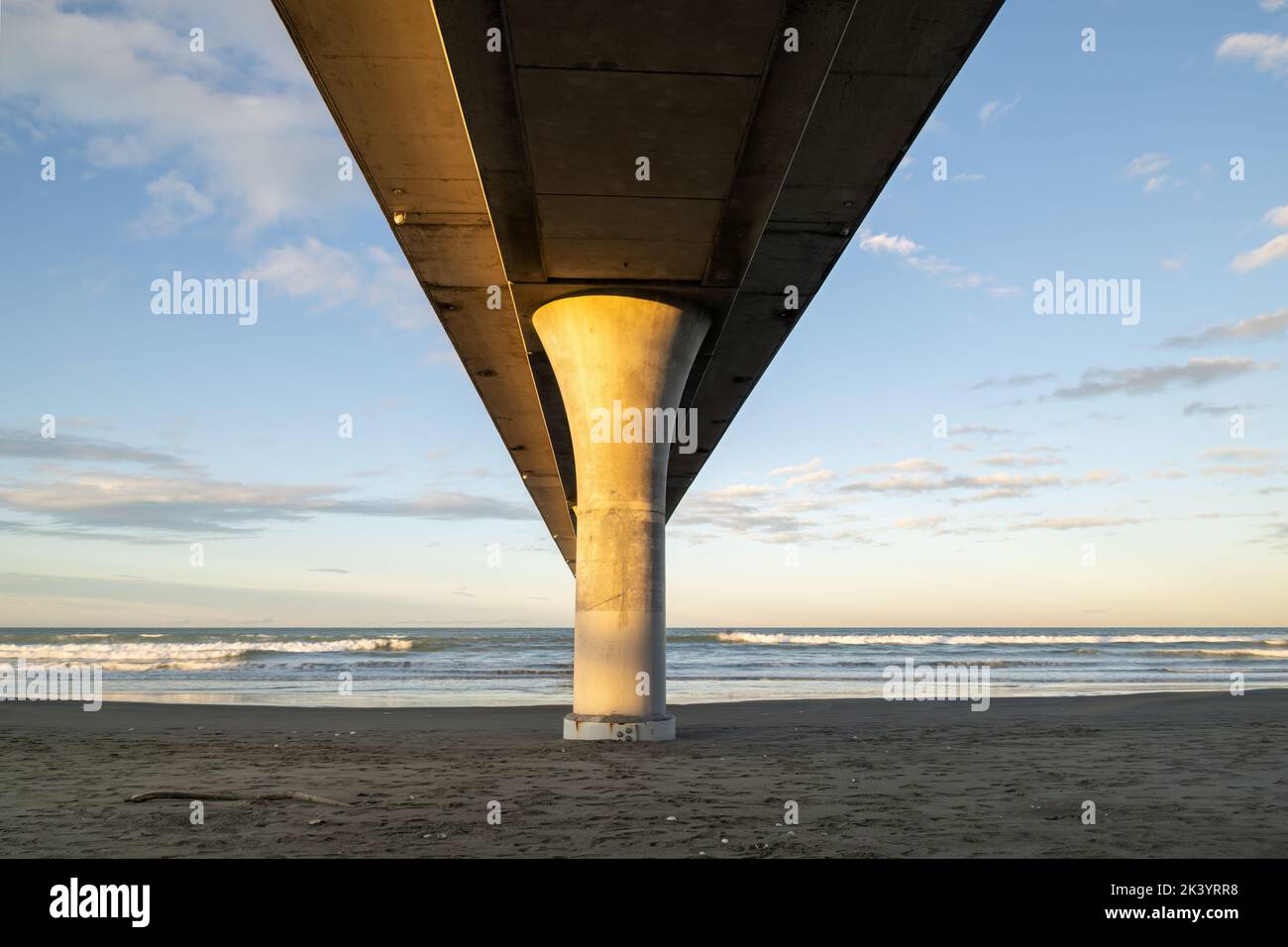 View under New Brighton Pier with massive concrete pillar. Christchurch ...