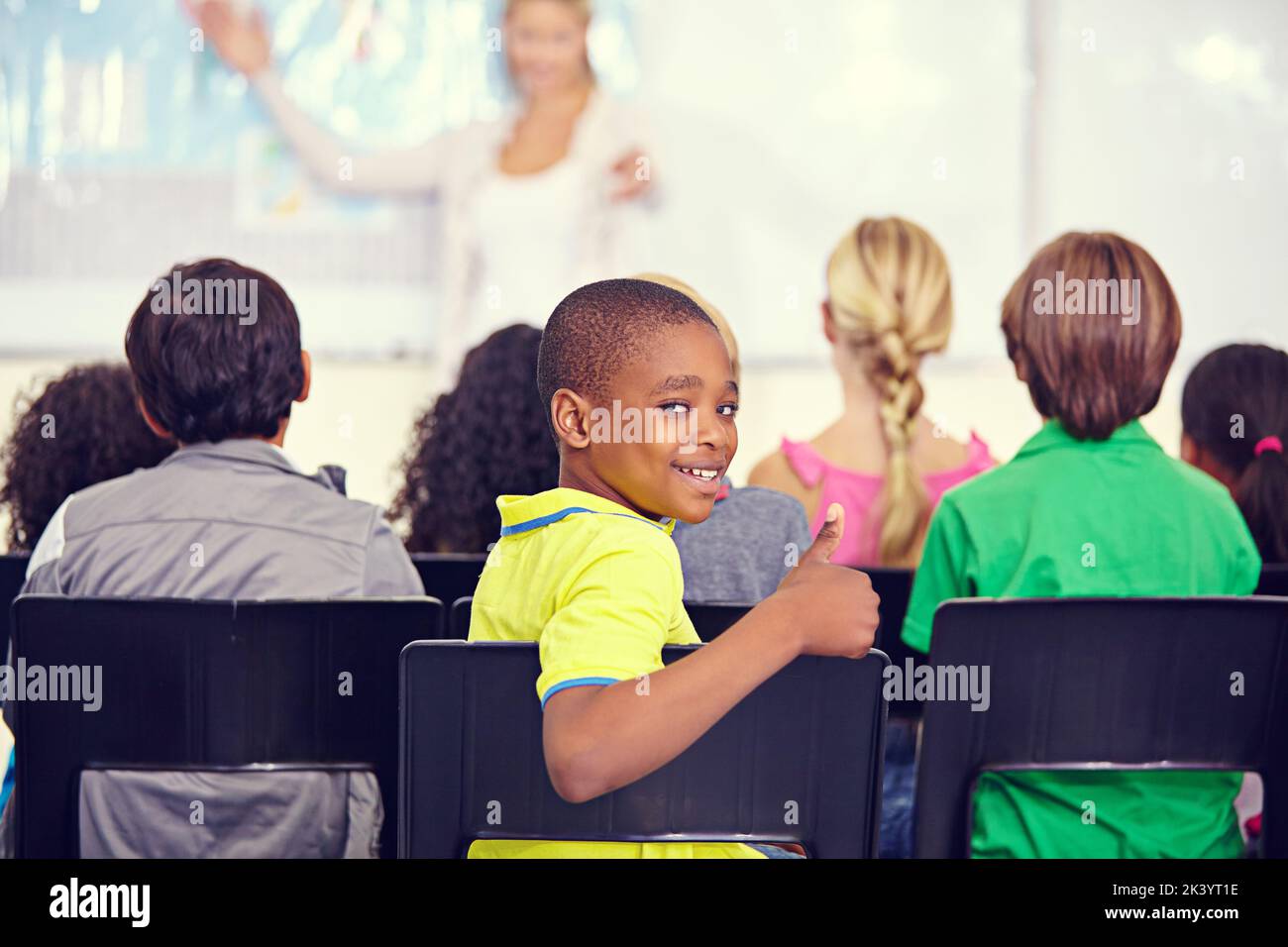 Learning so many new things today. A little boy showing thumbs up while ...