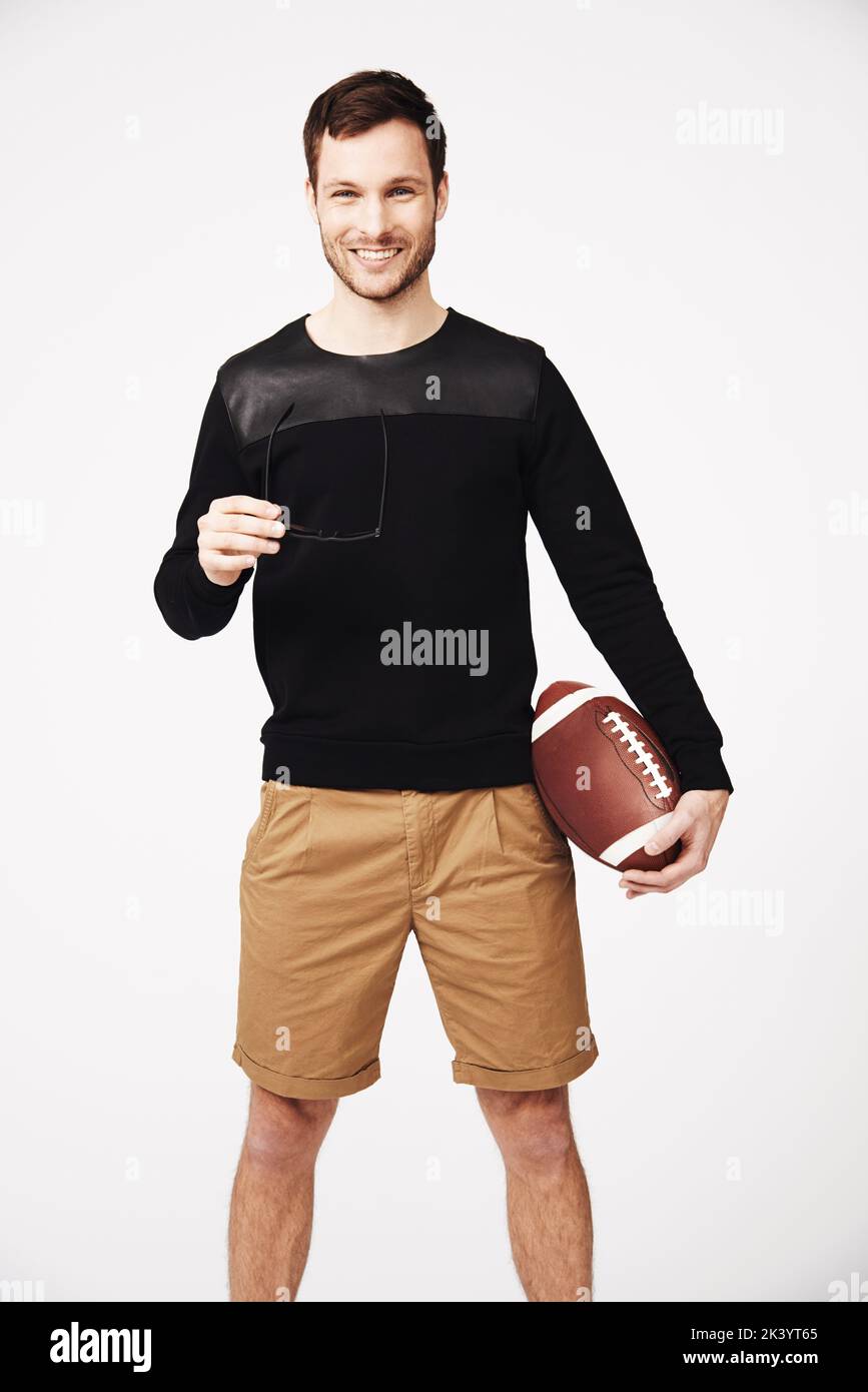 Hes ready for a physical game. A confident young man looking stylish ...