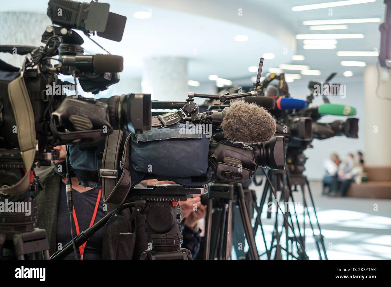 Cameras with microphones shooting interview Stock Photo - Alamy