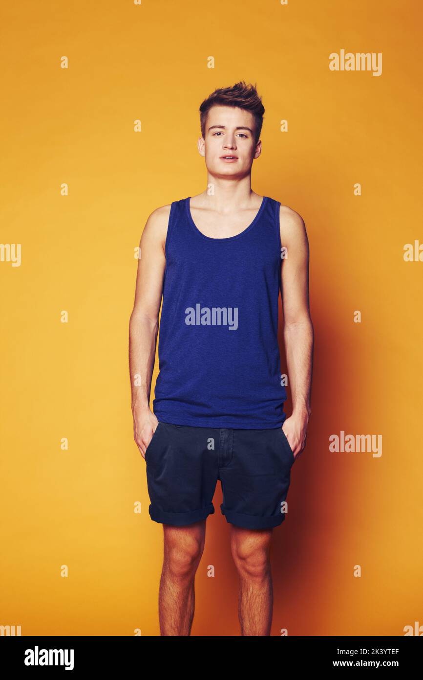 Confident and collected. Studio portrait of a young man standing ...