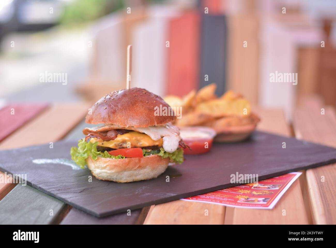 Burger menu on the black slate signboard Stock Photo - Alamy