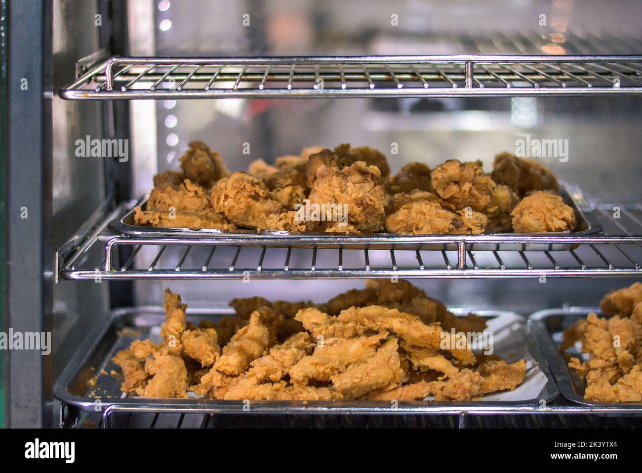 Crispy chicken in professional oven Stock Photo - Alamy
