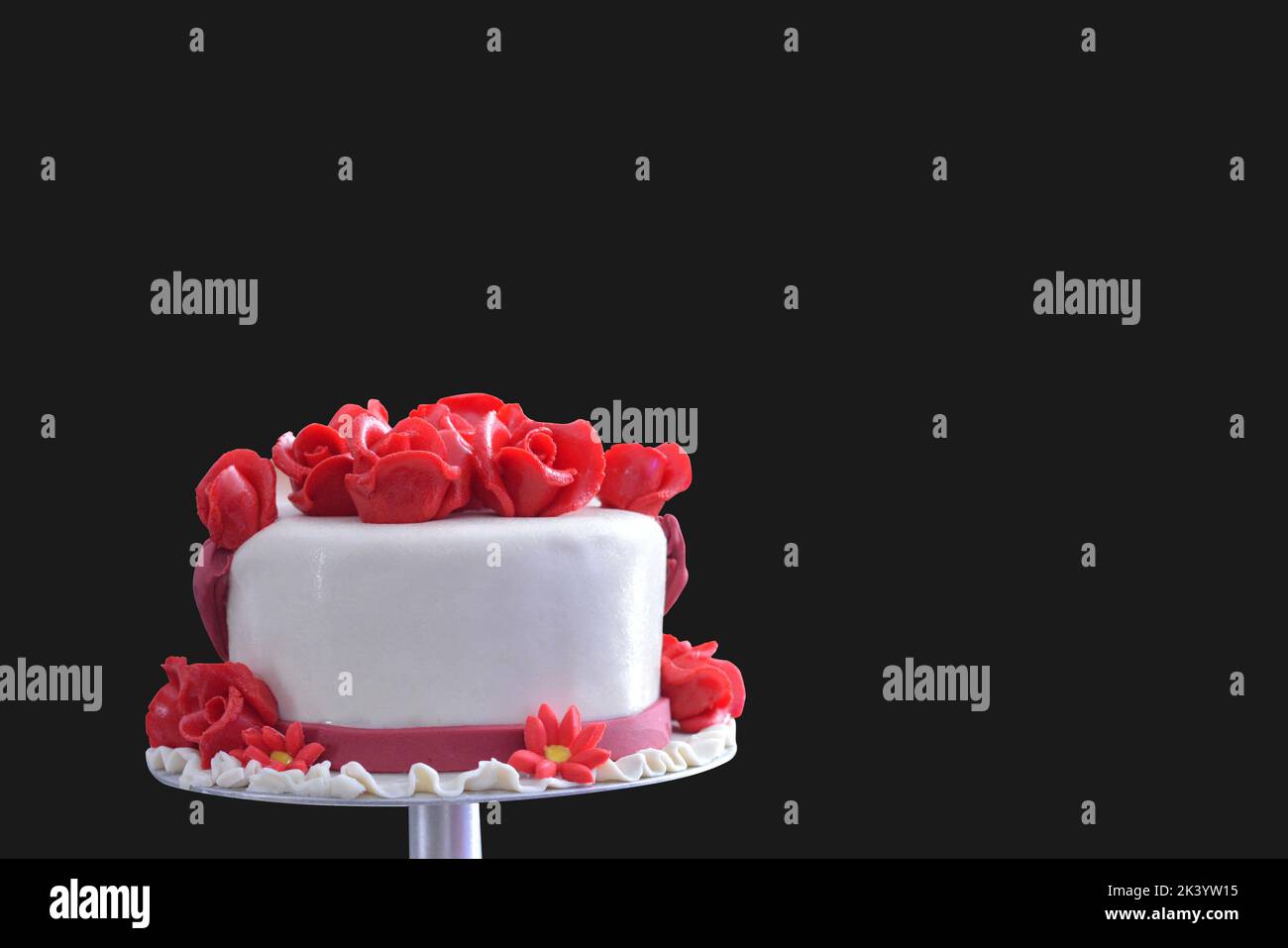 A little ugly cake with red marzipan roses Stock Photo - Alamy