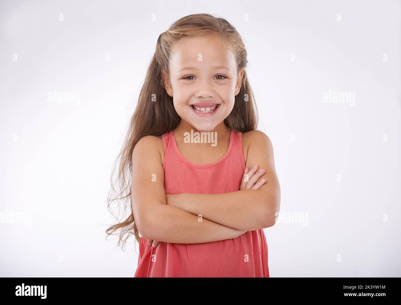 What a cutie. Studio portrait of an adorable young girl smiling at the ...