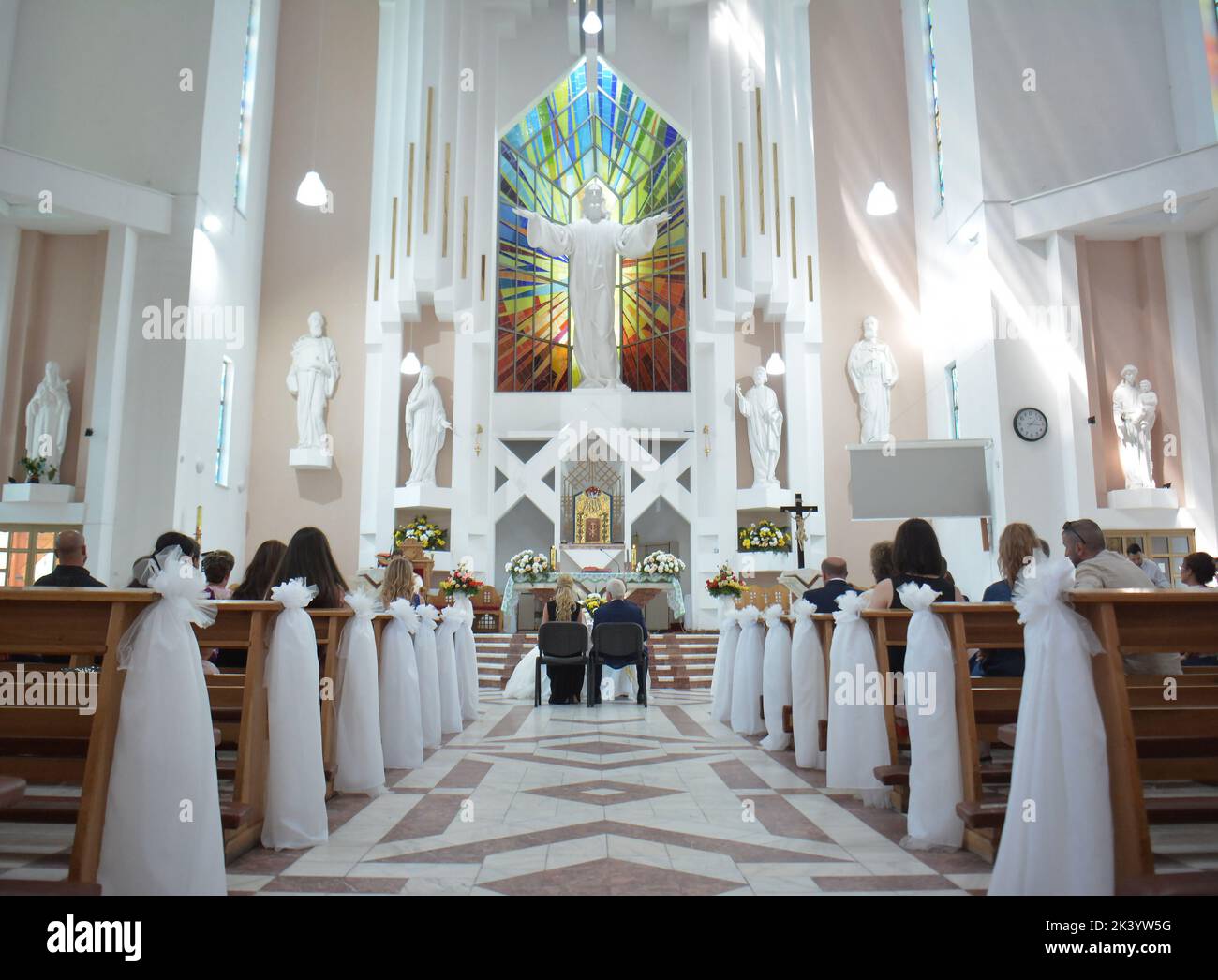 Bride and groom at the church during a wedding ceremony Stock Photo - Alamy