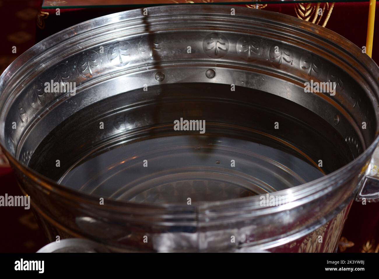 Orthodox baptism. An church bowl with water. A baptismal font Stock Photo - Alamy