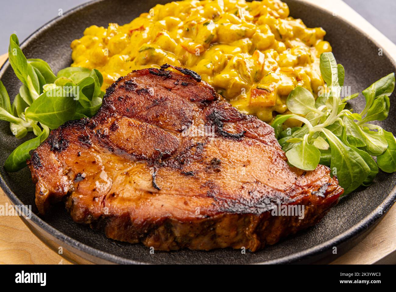 Food recipe background. Sliced grilled meat with Hungarian noodles side ...