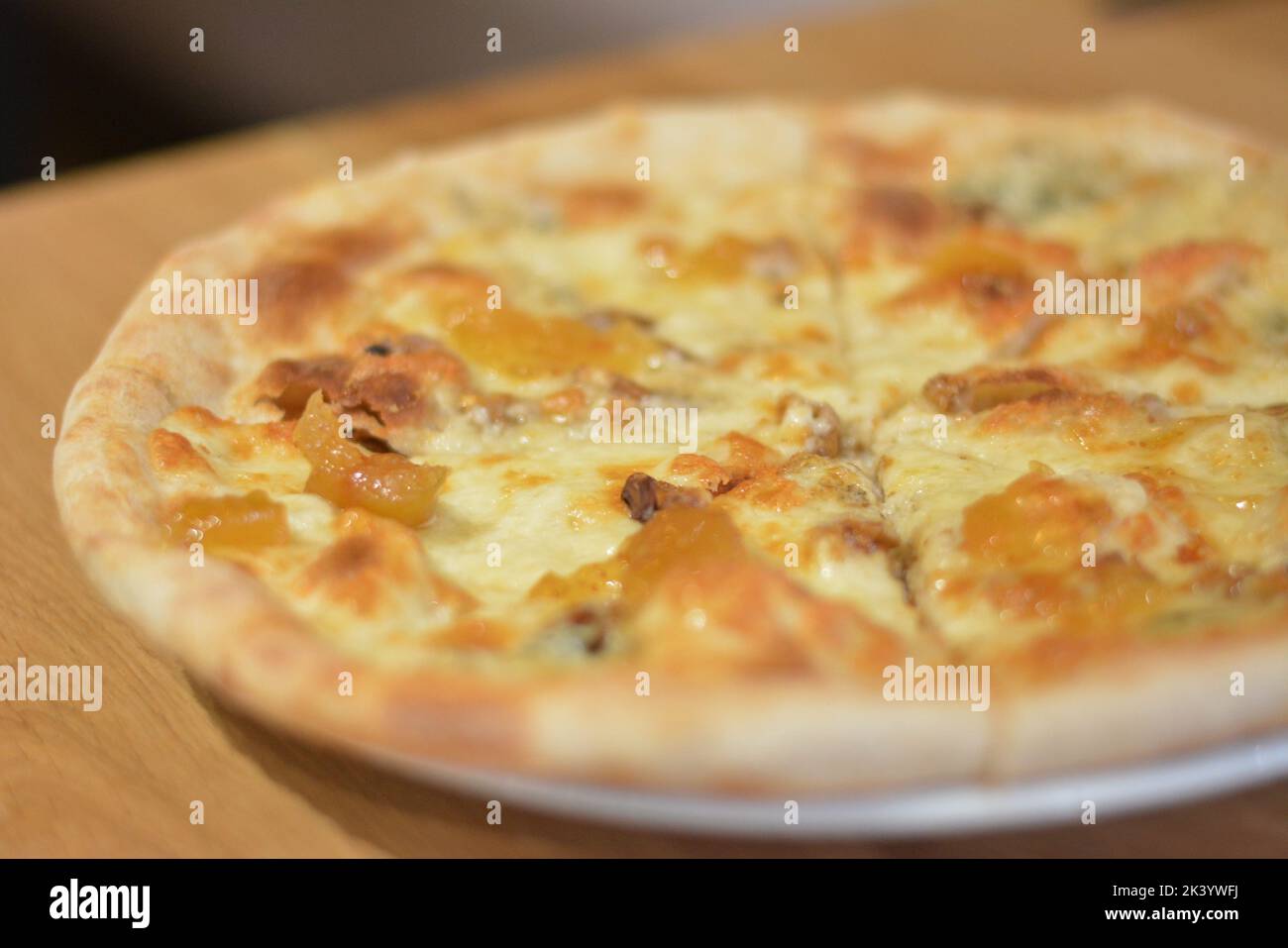 Pizza with four kinds of cheese. Italian pizza. Pizza quattro formaggi Stock Photo - Alamy