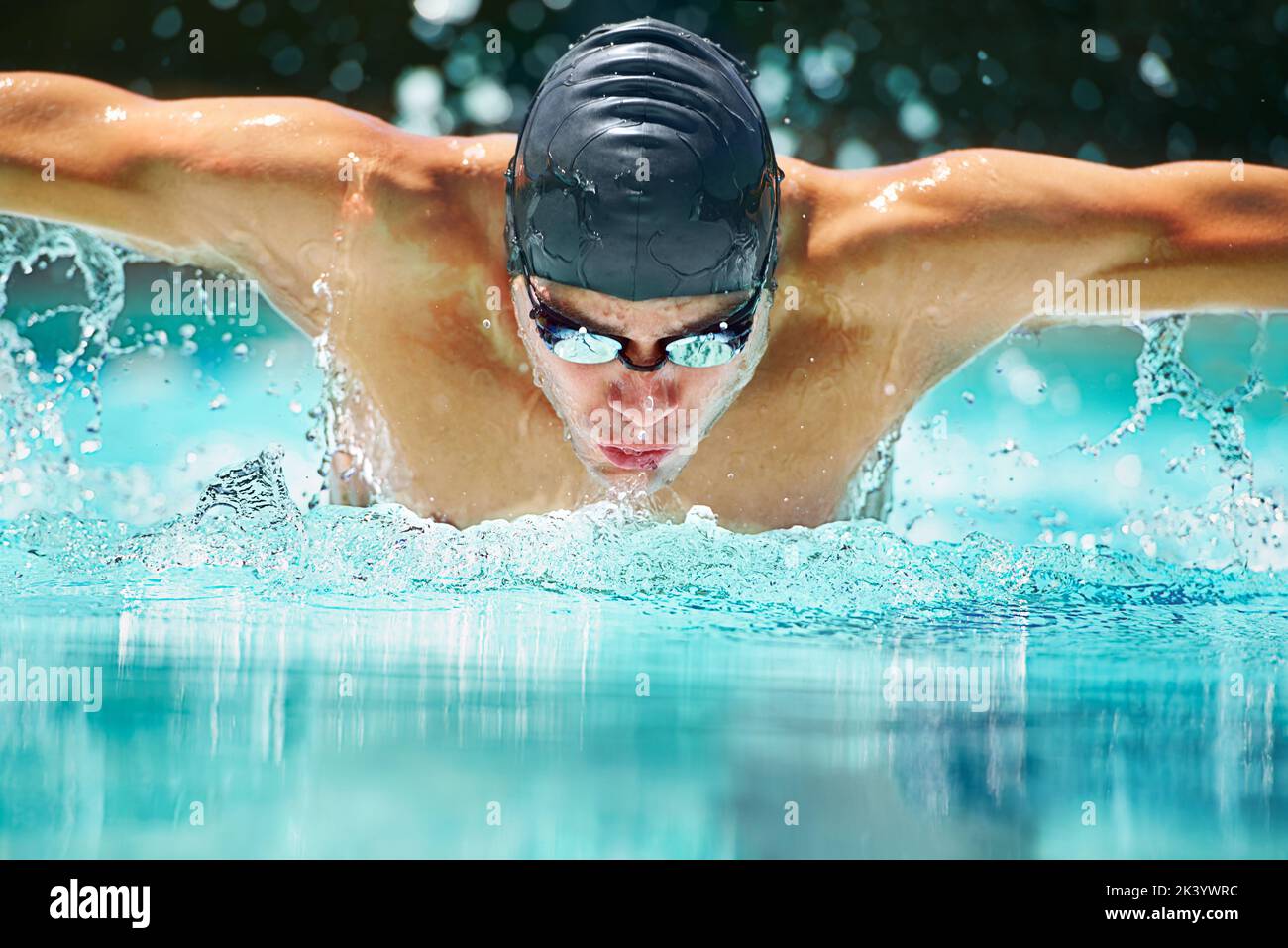 Perfect butterfly stroke. a male swimmer doing the butterfly stroke ...