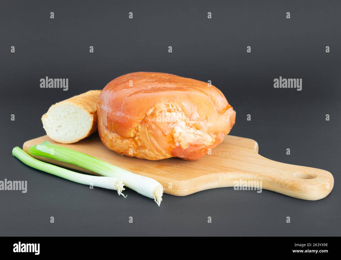 Ham on a wood plate Stock Photo - Alamy