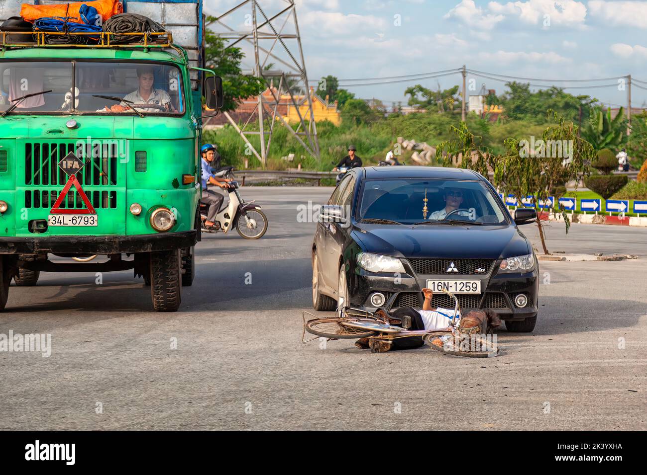 Accident between car driver and bicycle rider at road junction, Hai ...