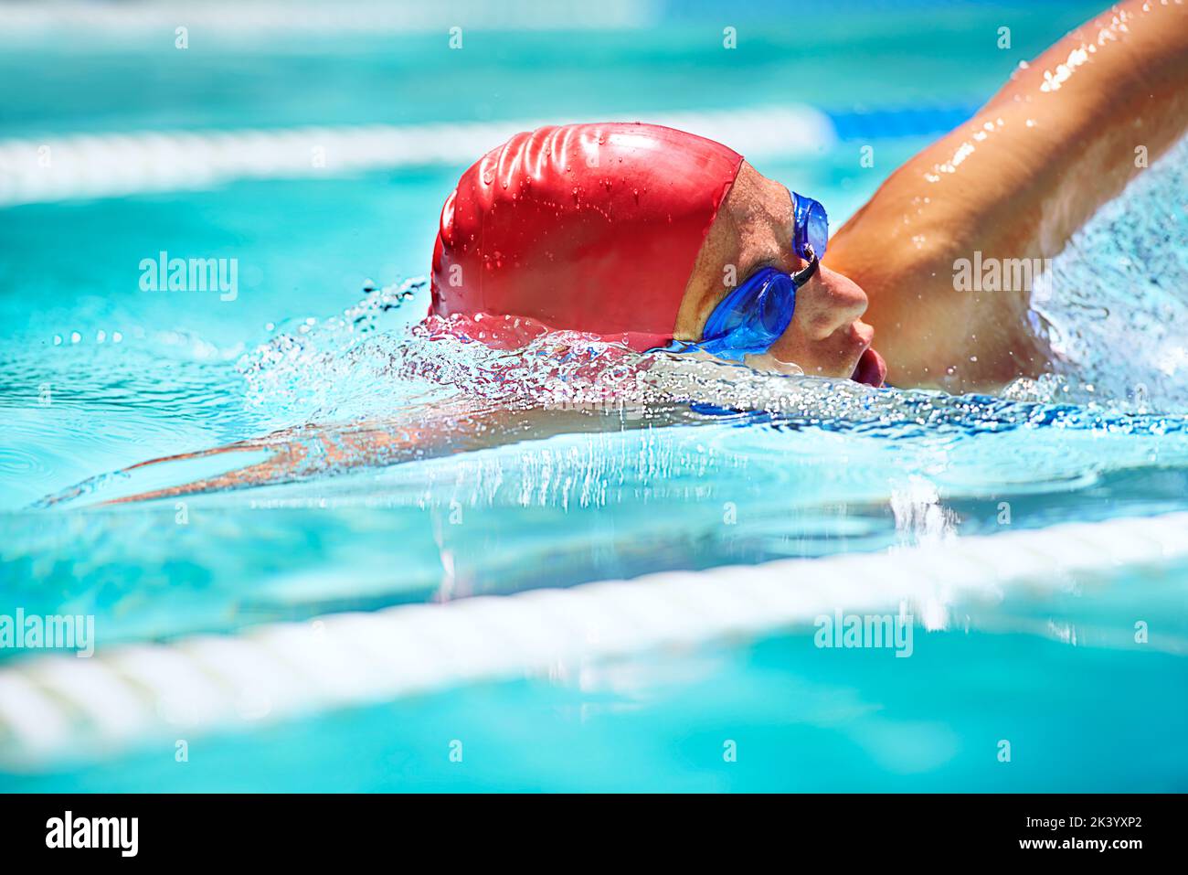 Working on her stroke. a professional female swimmer freestyle swimming ...