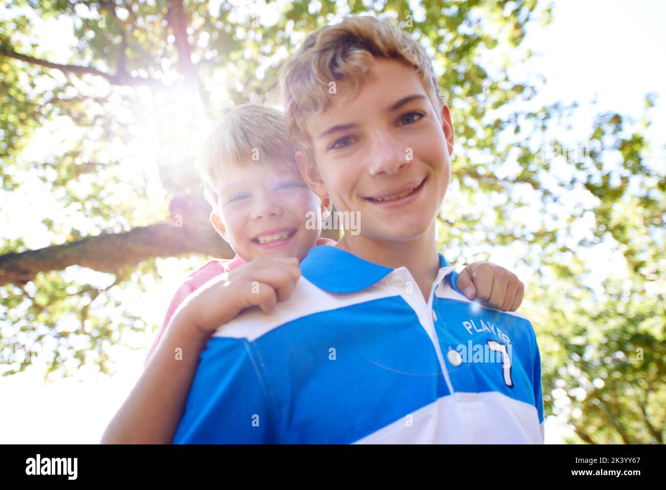 Vacation with my little brother. Low angle portrait of a brother giving ...