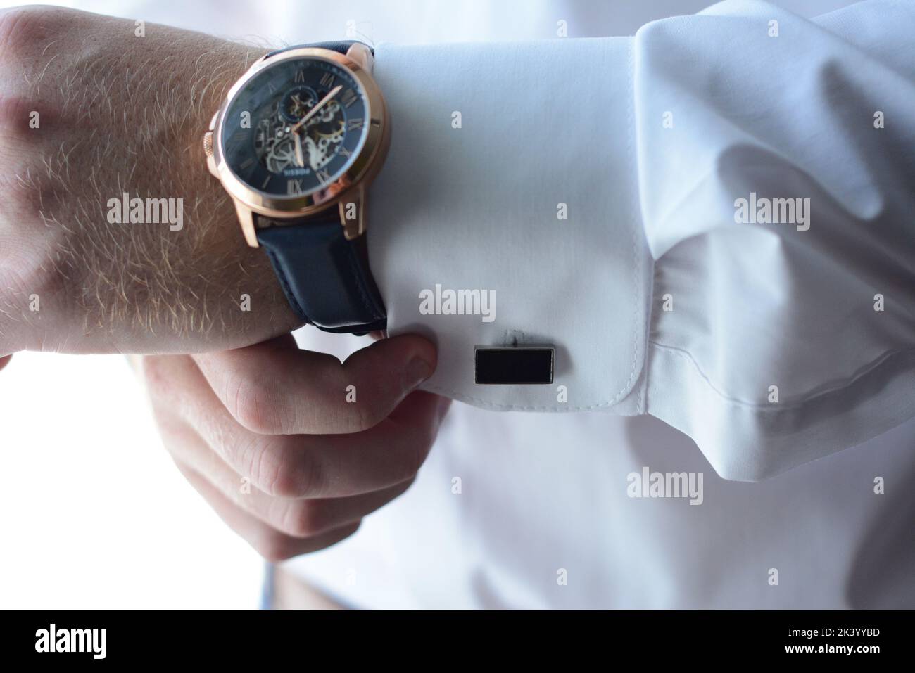 Hand attaching blue white employee hi-res stock photography and images ...