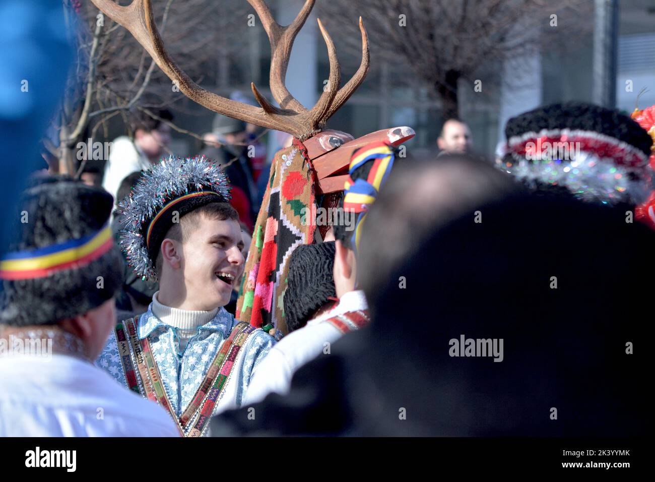 Young man dressed in the traditional romanian port. Goat game.The ...