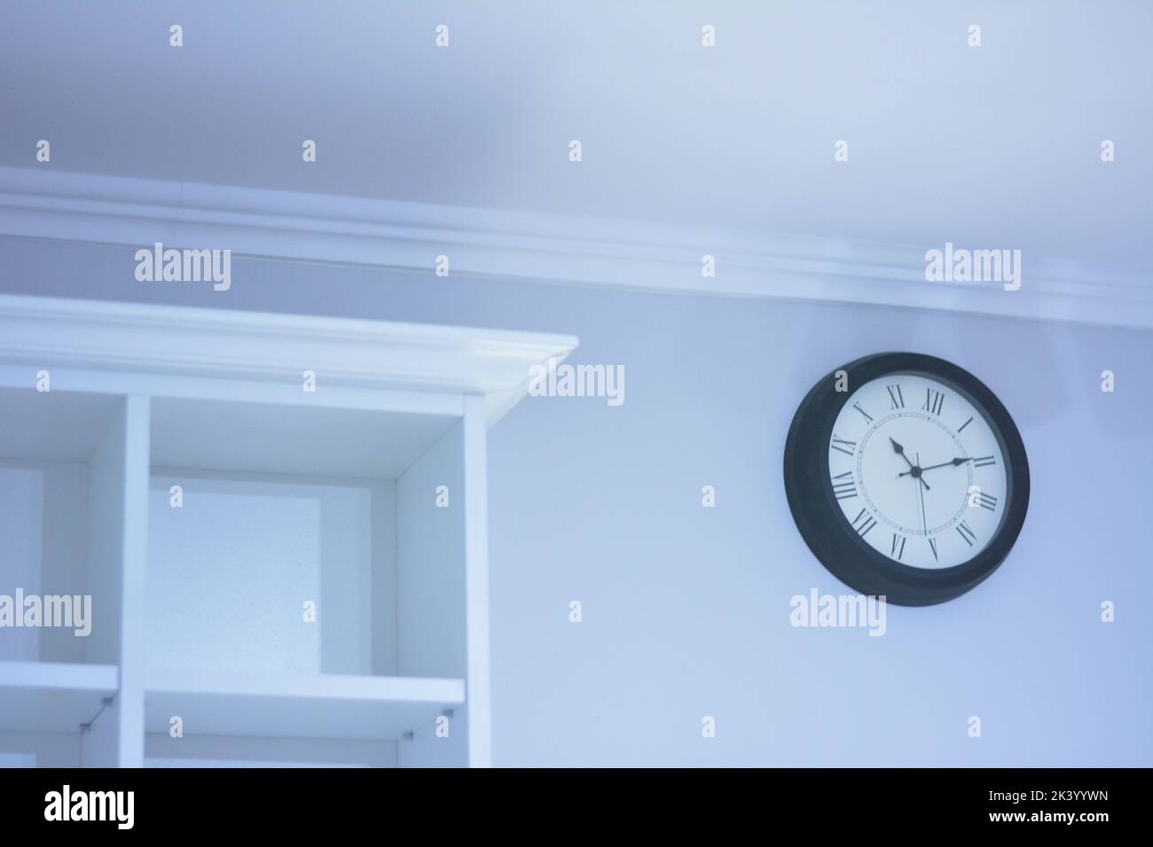 Old style clock on the wall Stock Photo - Alamy