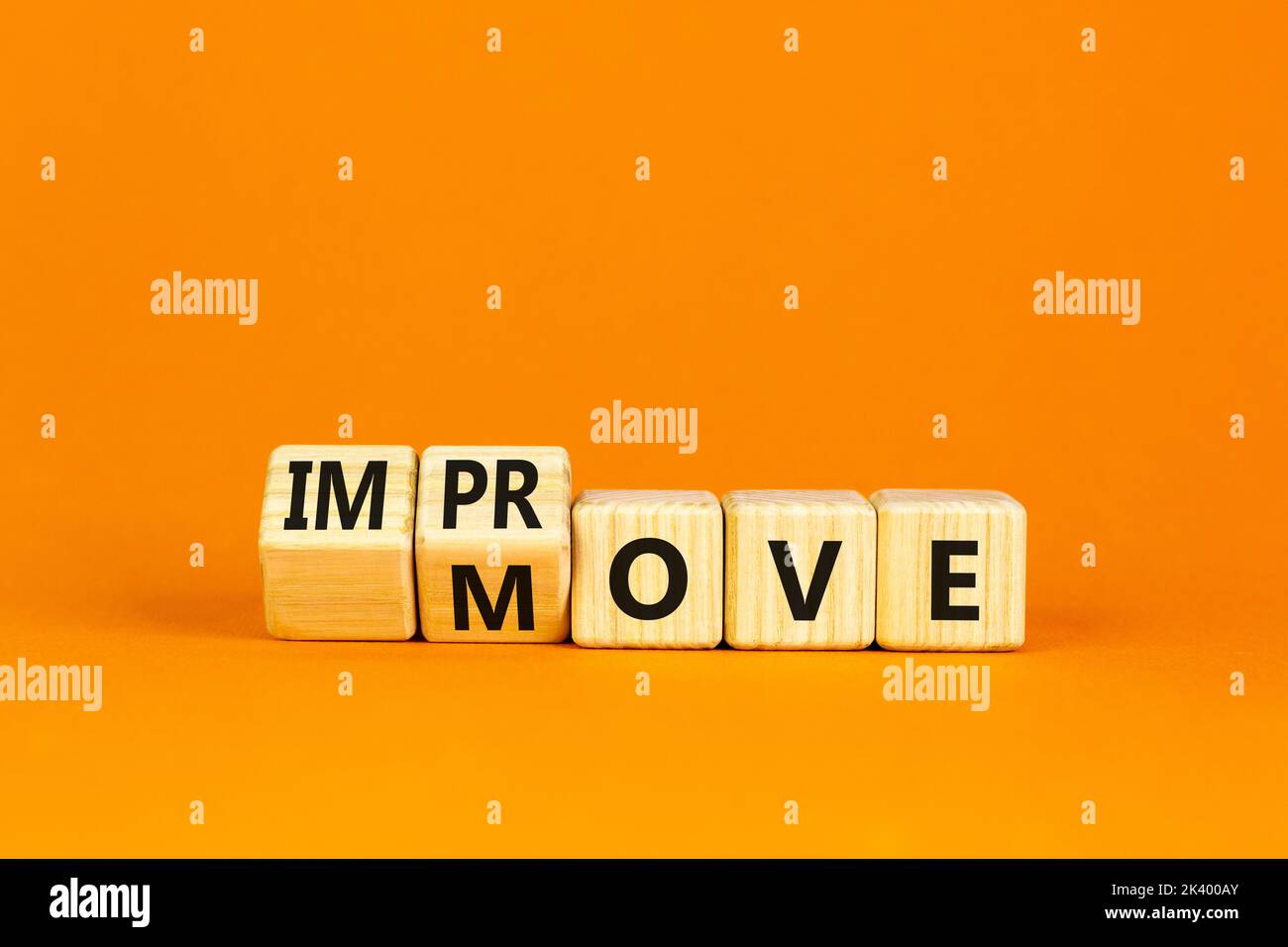 Move and improve symbol. Concept words Move and Improve on wooden cubes ...
