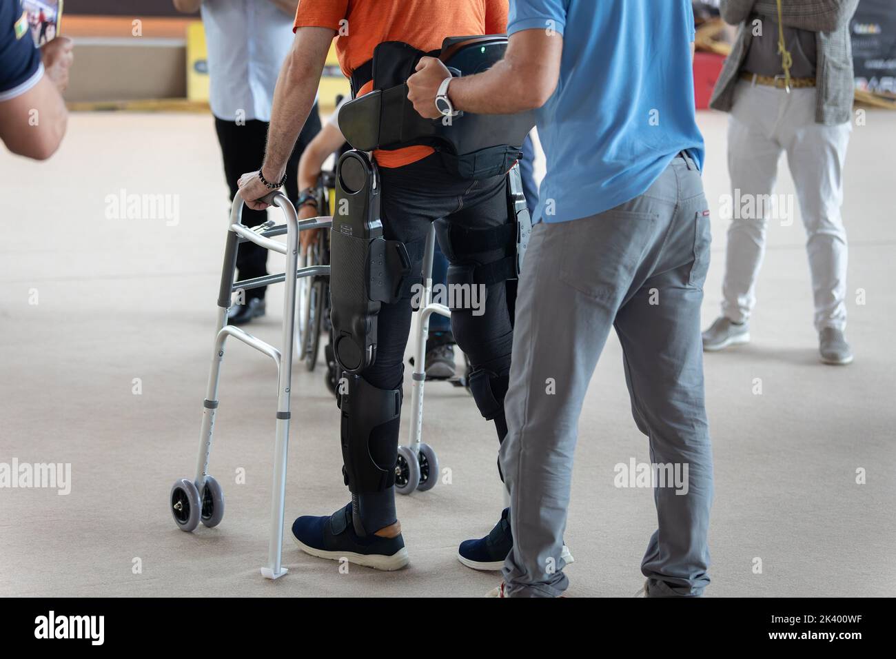 Boy with Mobility Problems in Lower Limbs in Upright Posture Walking ...