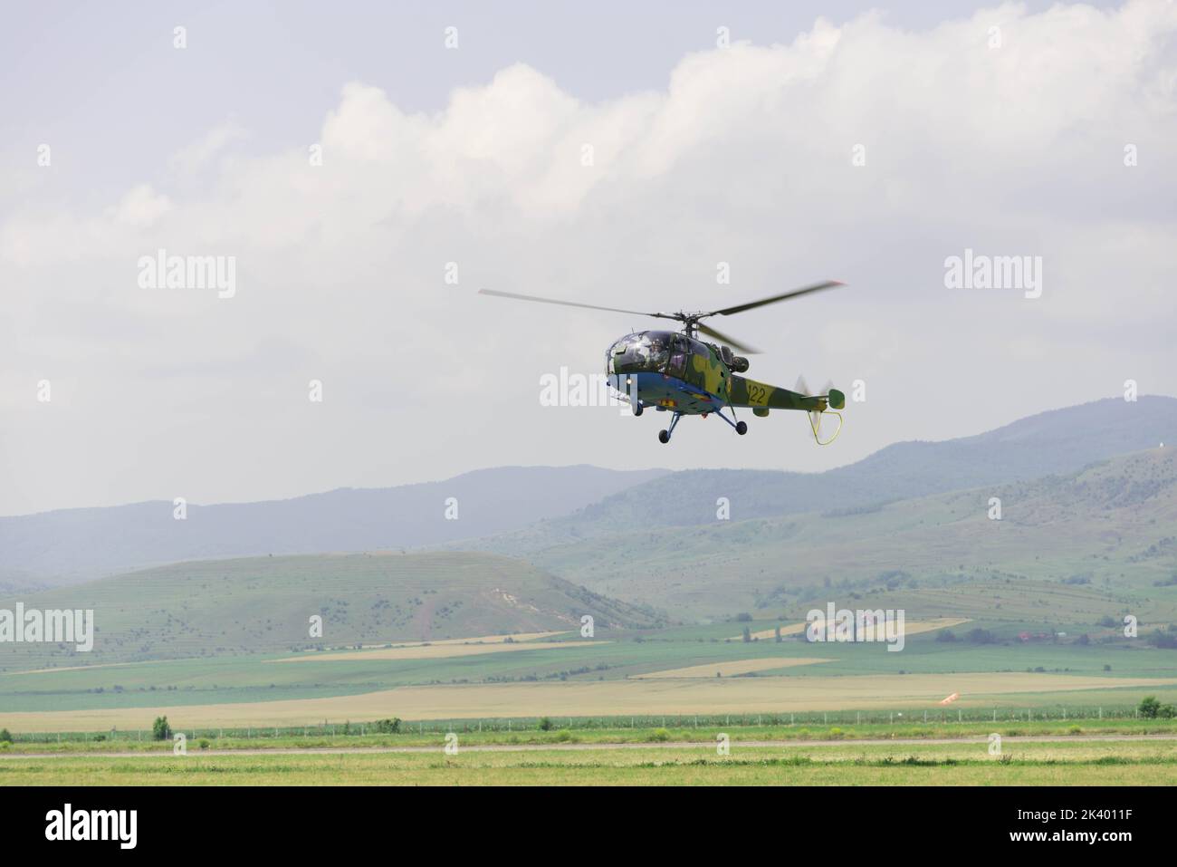 Flying helicopter over the plain area Stock Photo - Alamy