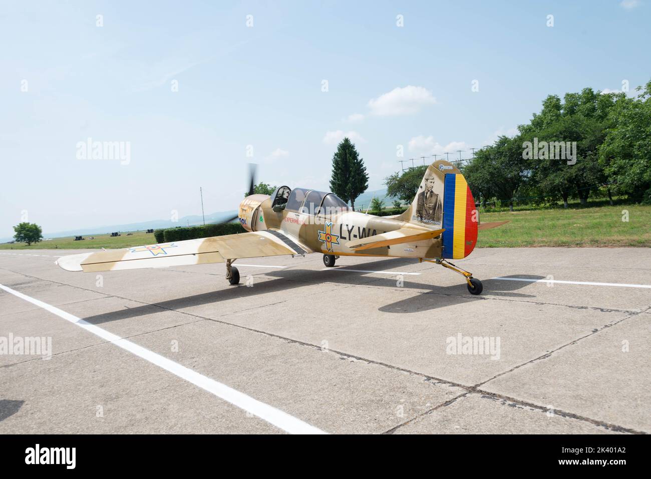 Propeller plane at the air show preparing to take off from the ground ...