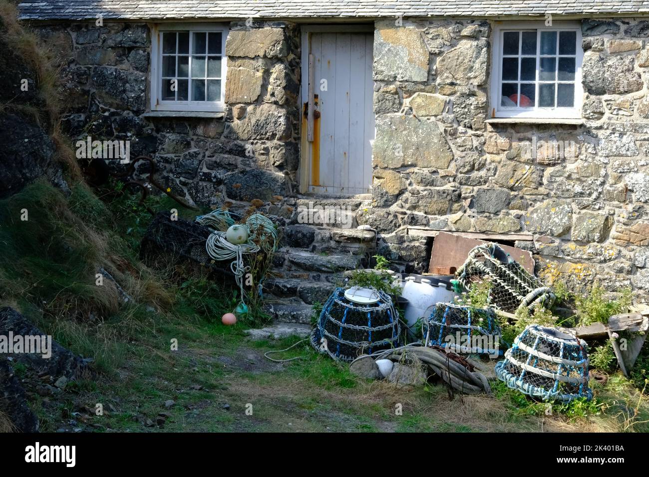 Historic fishing hut by the side of Mullion Harbour in Cornwall Stock ...