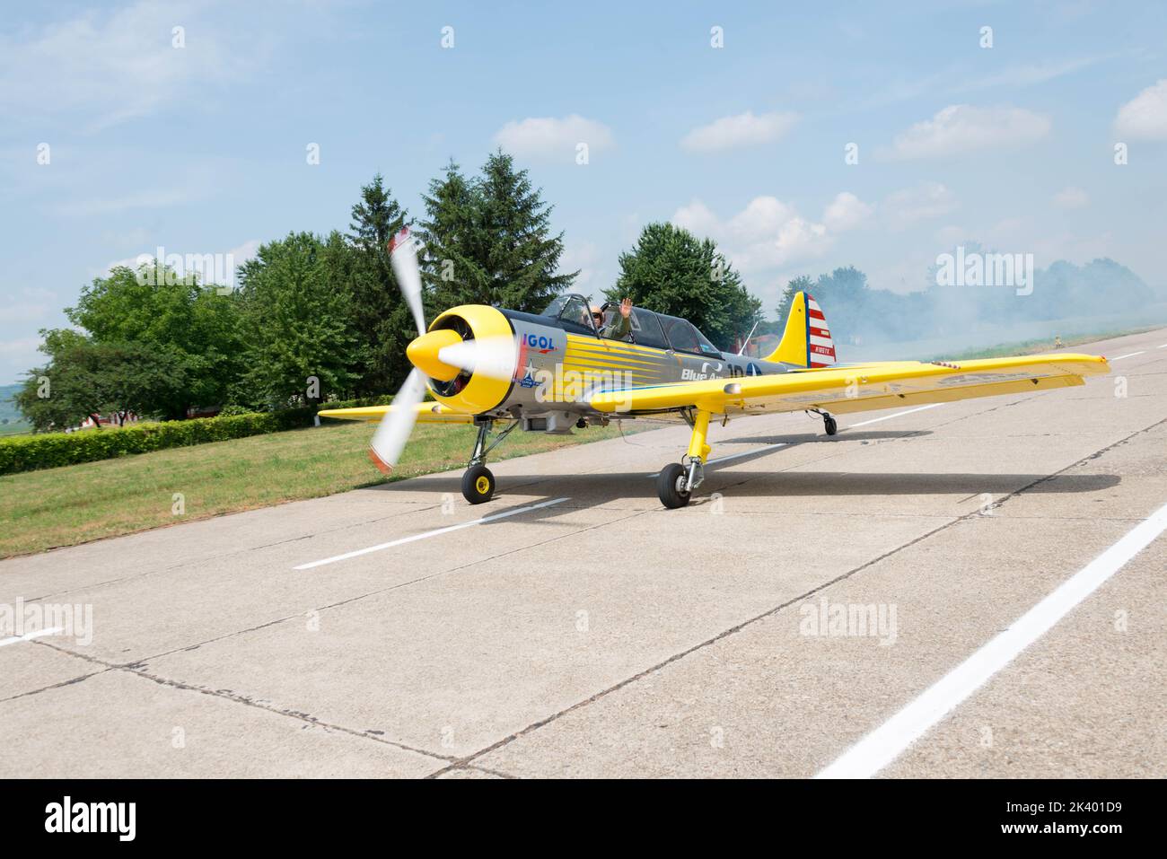 Airshow demonstration of a propeller plane taking-off Stock Photo - Alamy