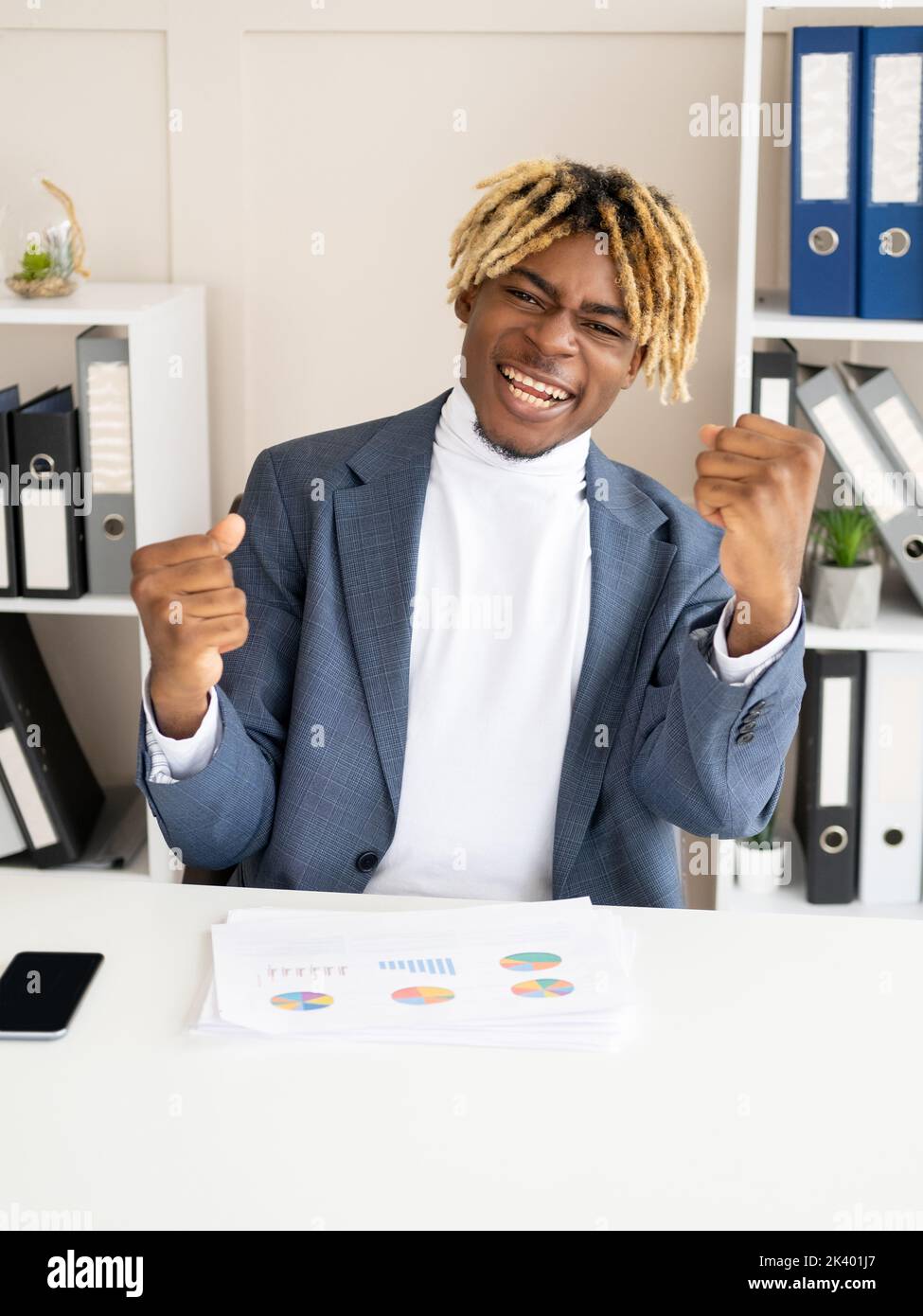 Great work. Excited black man. Successful result. Happy expressive guy ...