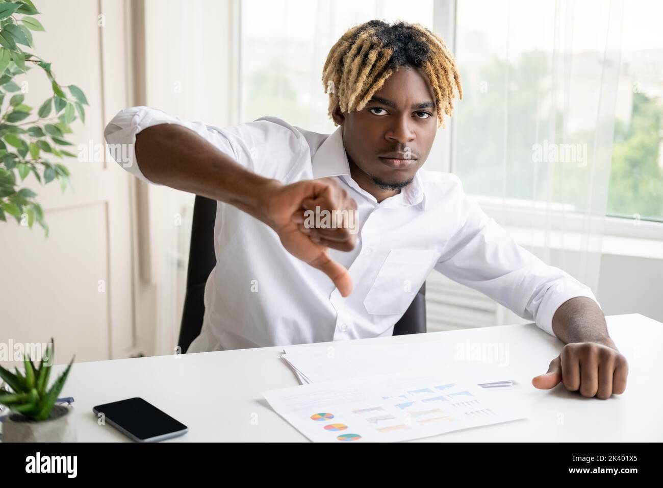 Bad job. Gloomy black man. Negative feelings. Disappointed male worker ...