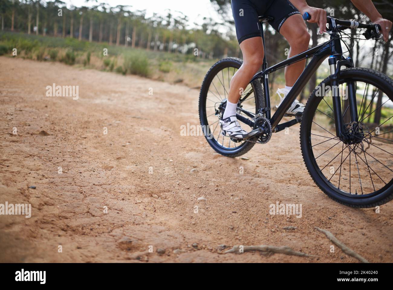 Mountain biking is addictive. Cropped view of a cyclist exploring ...