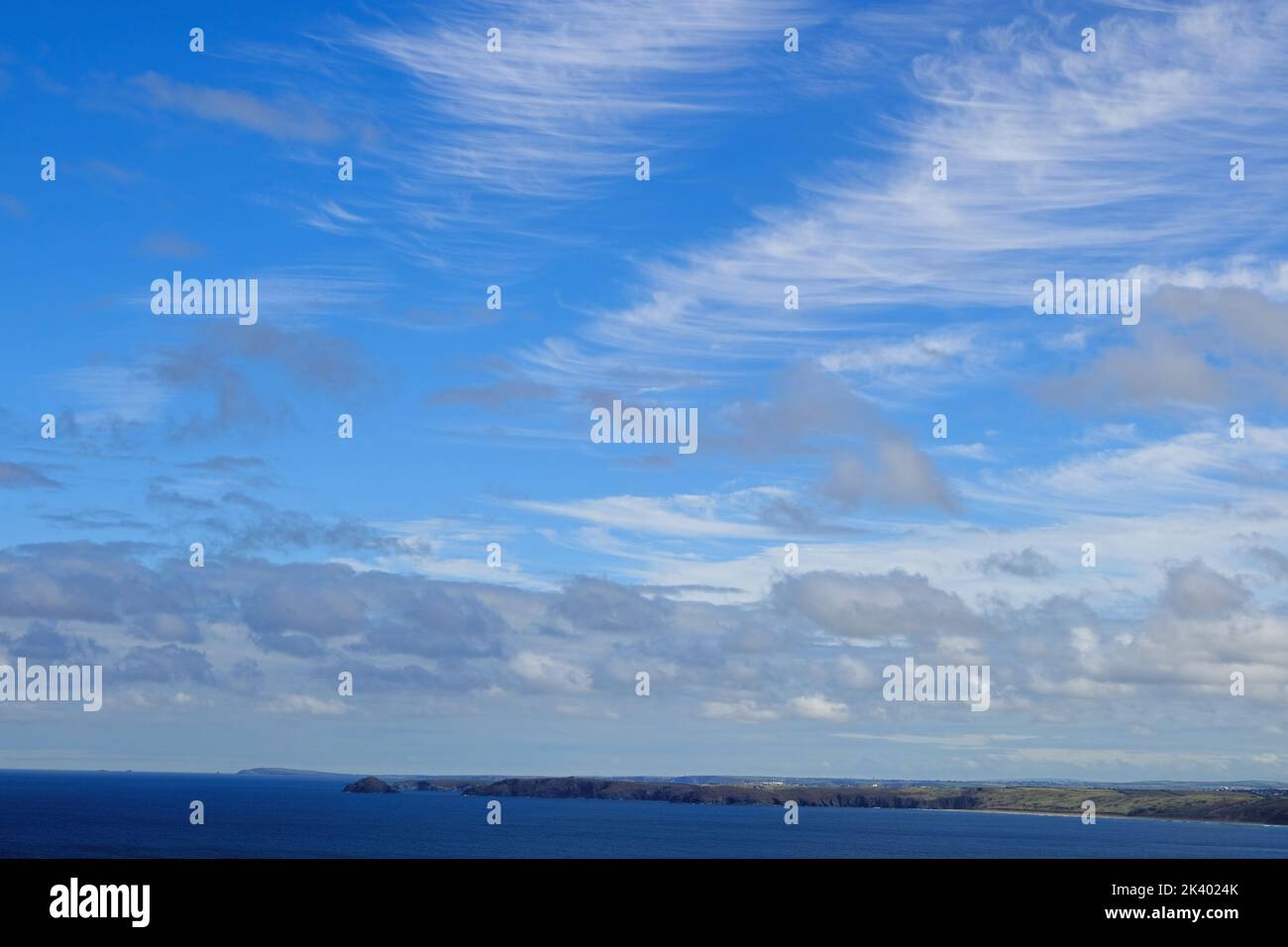 Summer sky with cirrus clouds on the north coast of Cornwall. Looking ...