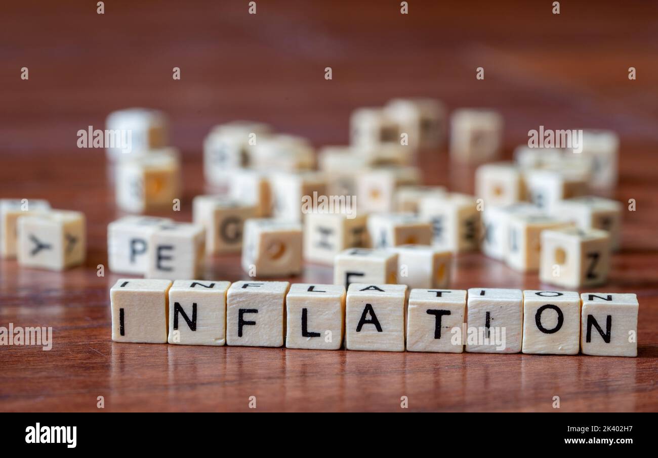 The word inflation on a wood background Stock Photo - Alamy