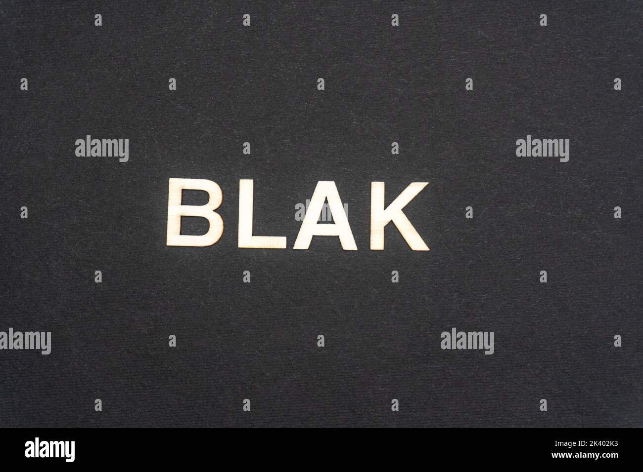 BLAK word written on dark paper background. BLAK text on dark for your ...