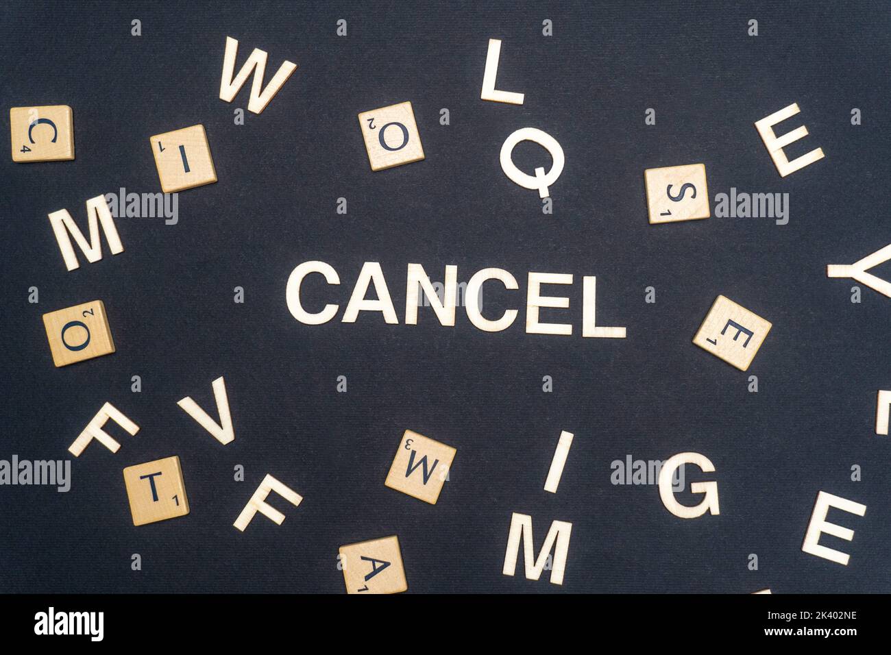 CANCEL word written on dark paper background. CANCEL text on dark for ...