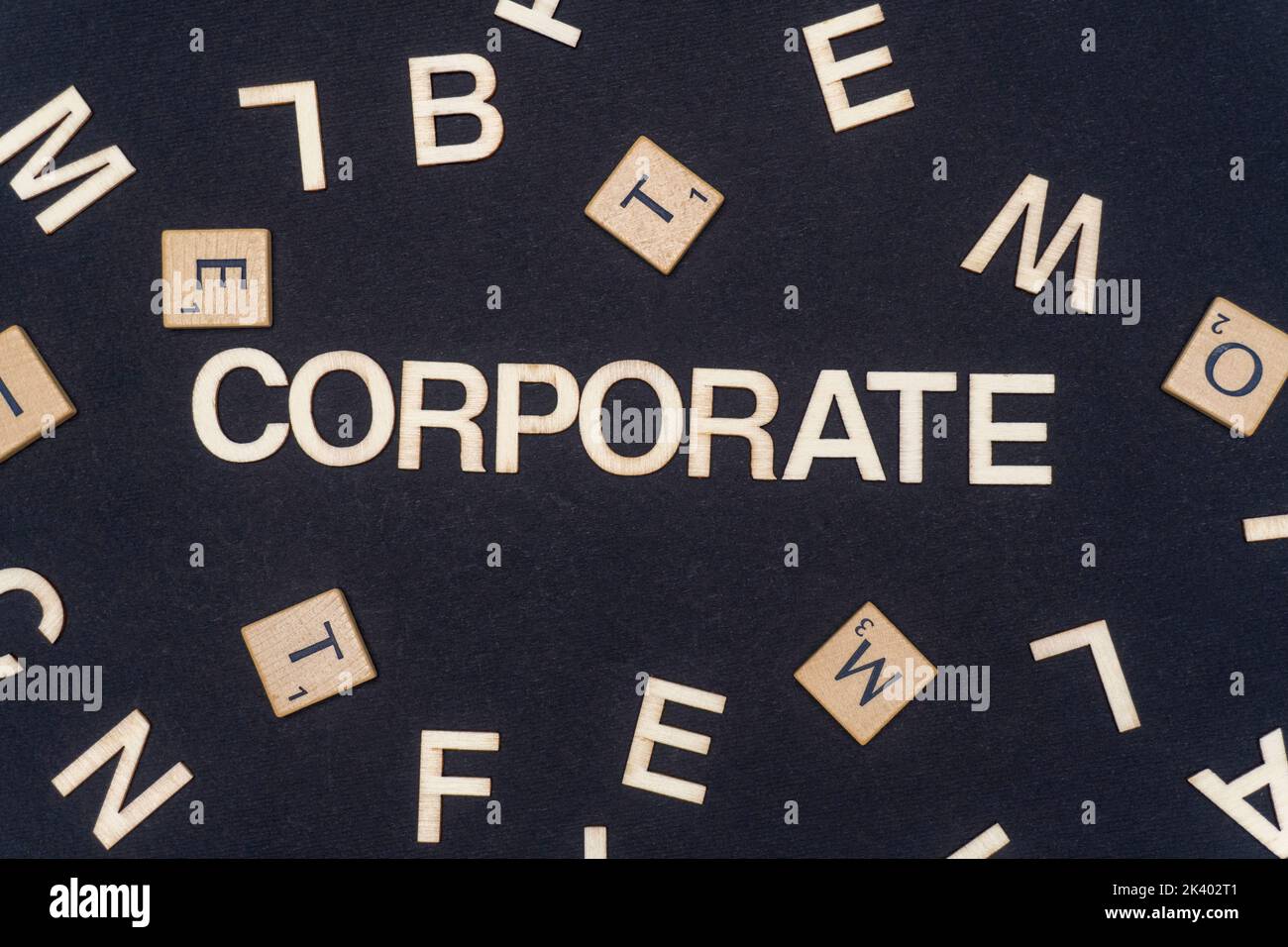 CORPORATE word written on dark paper background. CORPORATE text on dark ...