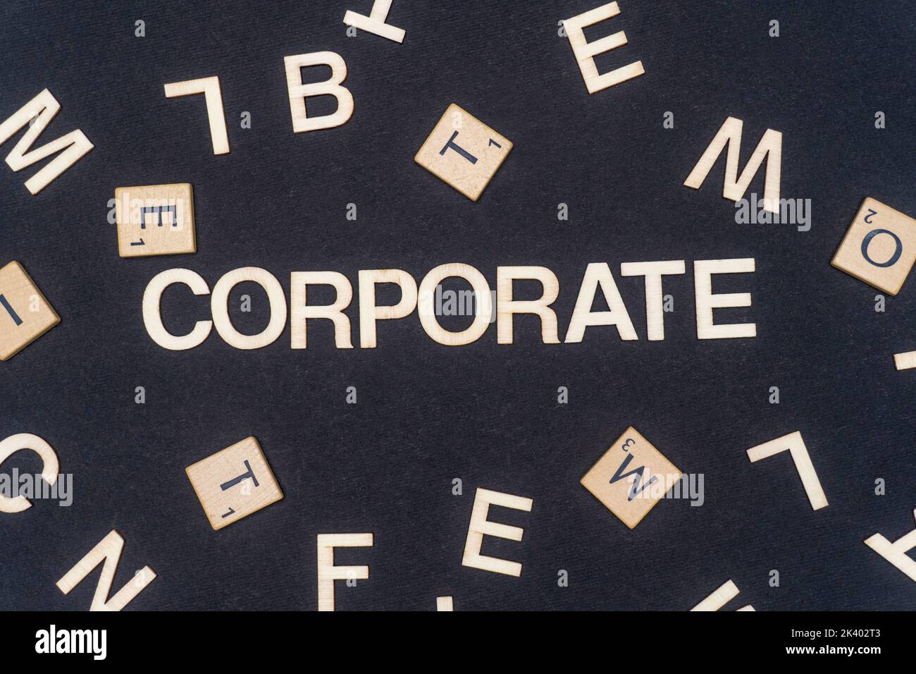 CORPORATE word written on dark paper background. CORPORATE text on dark ...