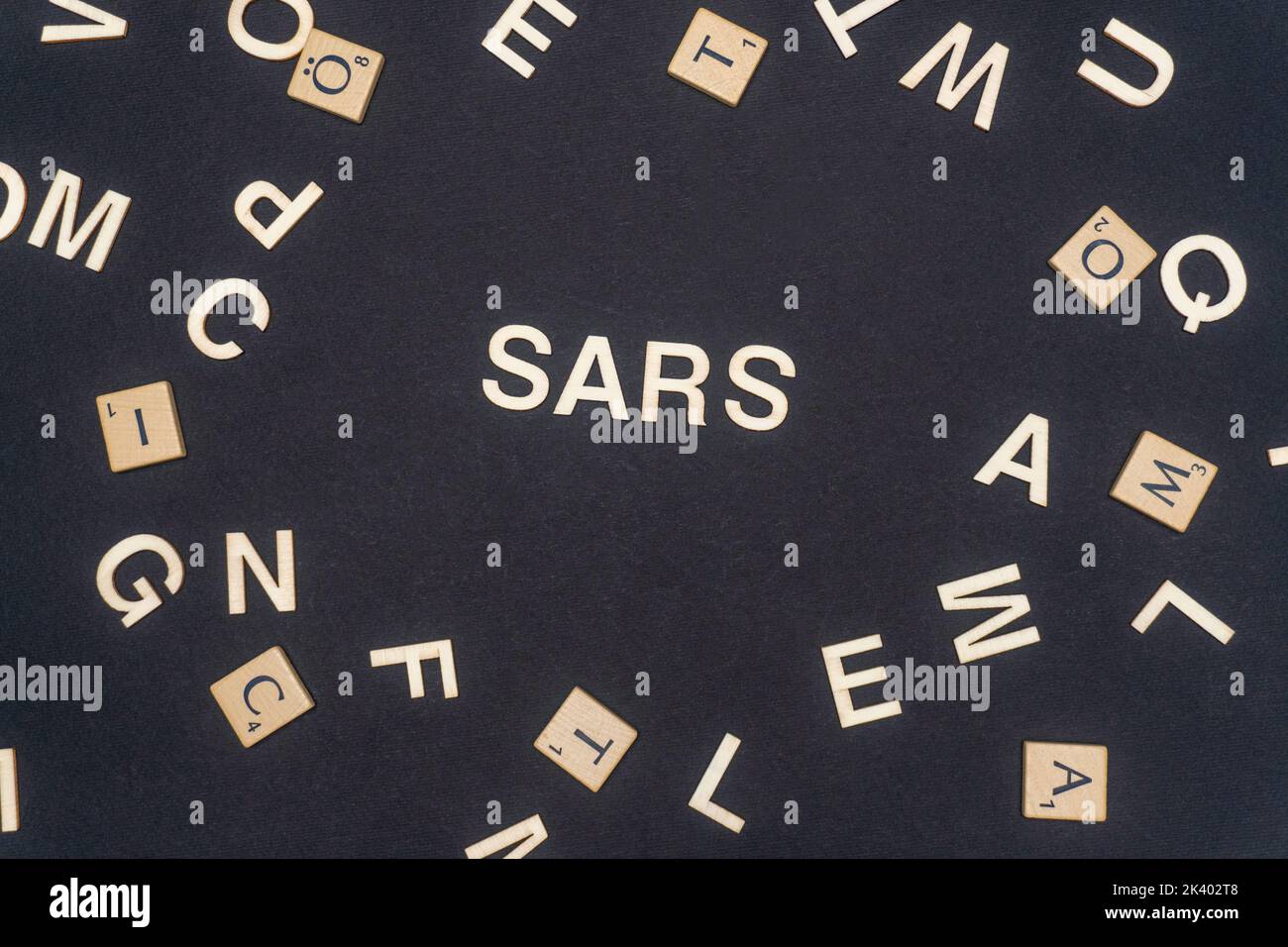 SARS word written on dark paper background. SARS text on dark for your ...