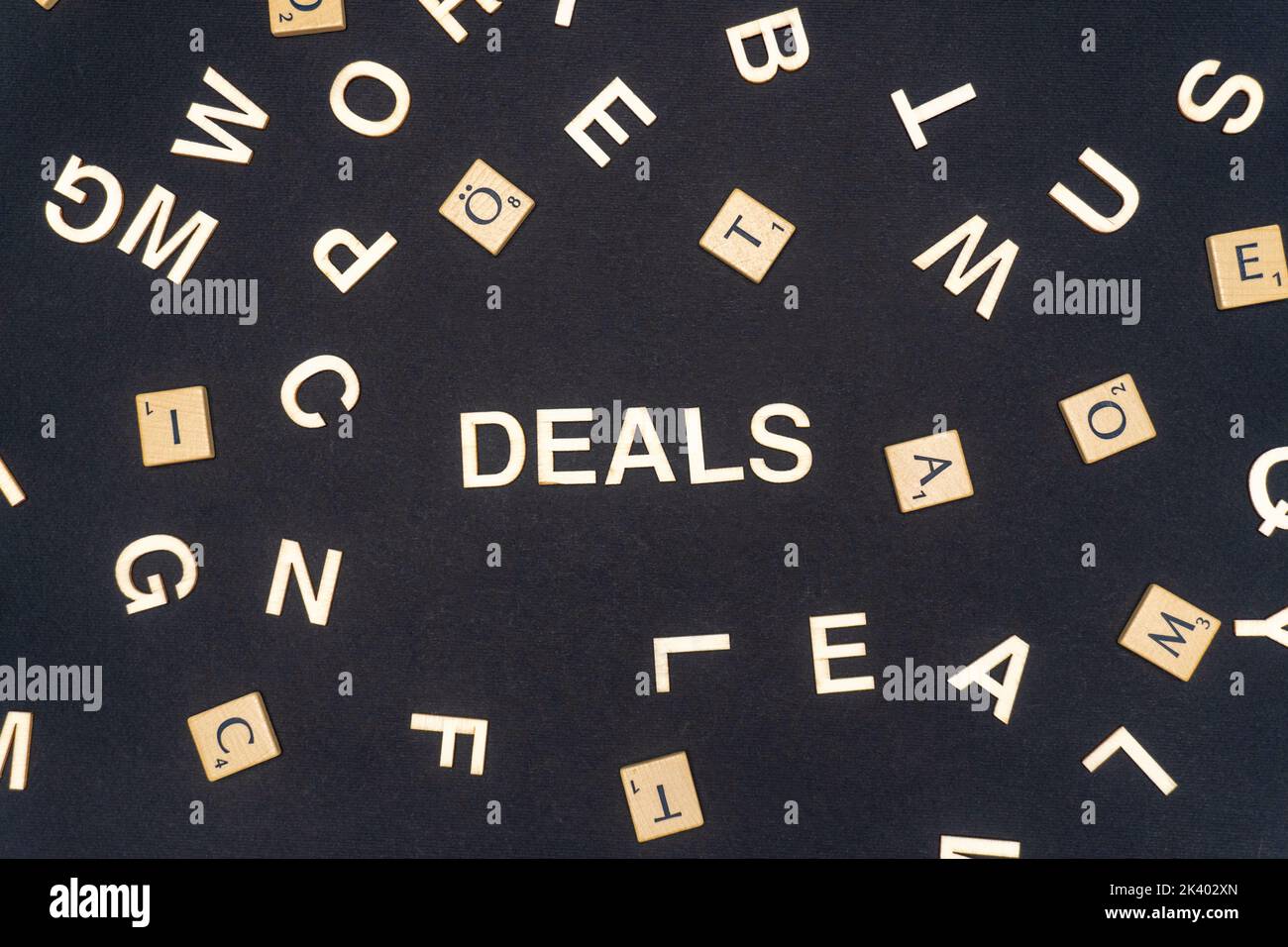 DEALS word written on dark paper background. DEALS text on dark for ...