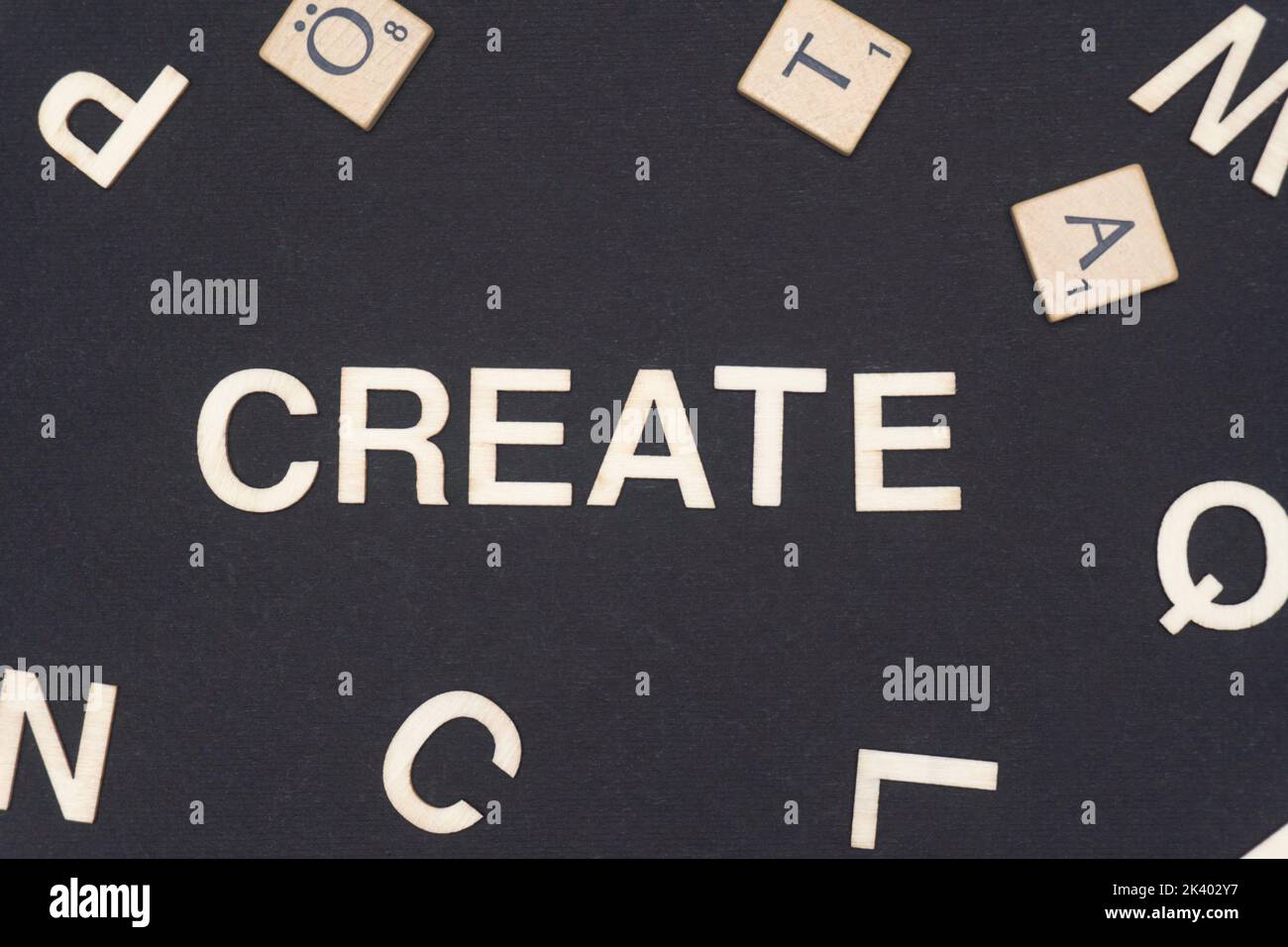 CREATE word written on dark paper background. CREATE text on dark for ...