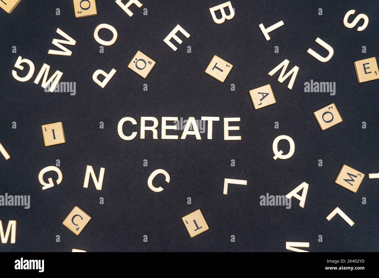 CREATE word written on dark paper background. CREATE text on dark for ...