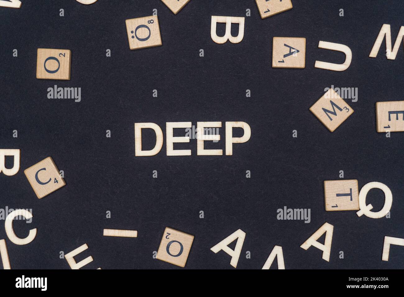 DEEP word written on dark paper background. DEEP text on dark for your ...