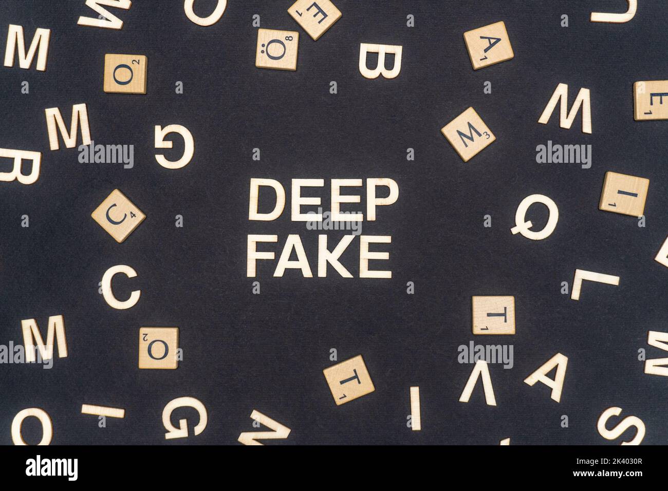 DEEP FAKE word written on dark paper background. DEEP FAKE text on dark ...