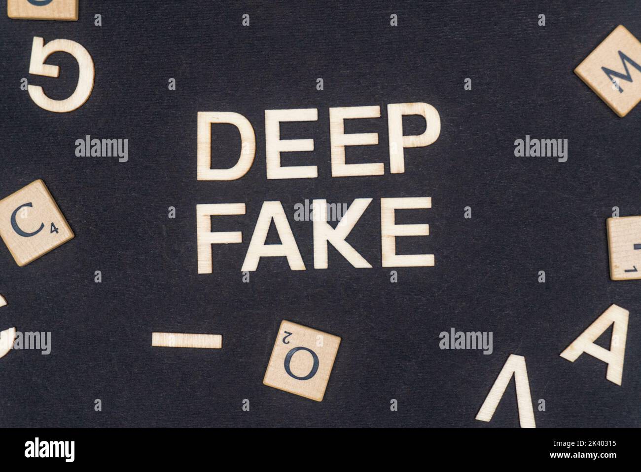 DEEP FAKE word written on dark paper background. DEEP FAKE text on dark ...