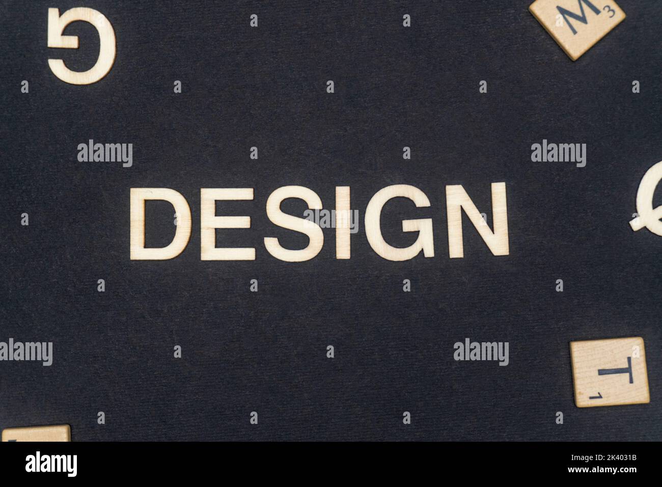 DESIGN word written on dark paper background. DESIGN text on dark for ...