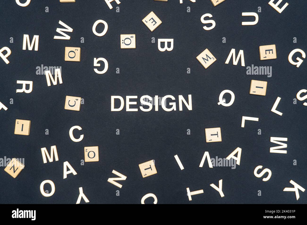 DESIGN word written on dark paper background. DESIGN text on dark for ...