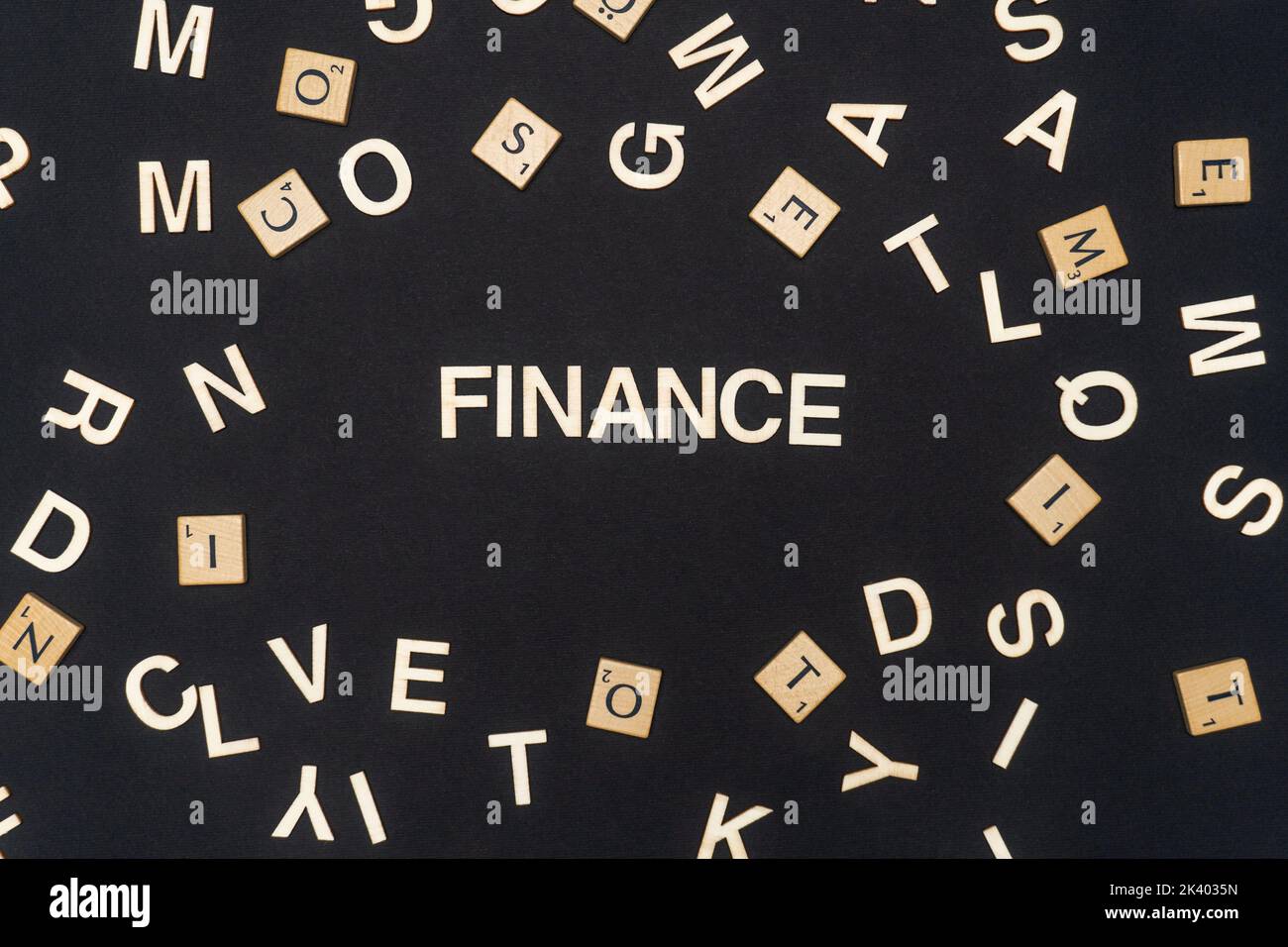 FINANCE word written on dark paper background. FINANCE text on dark for ...