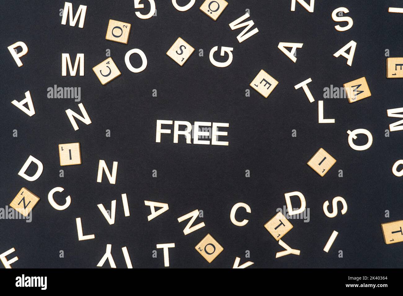 FREE word written on dark paper background. FREE text on dark for your ...