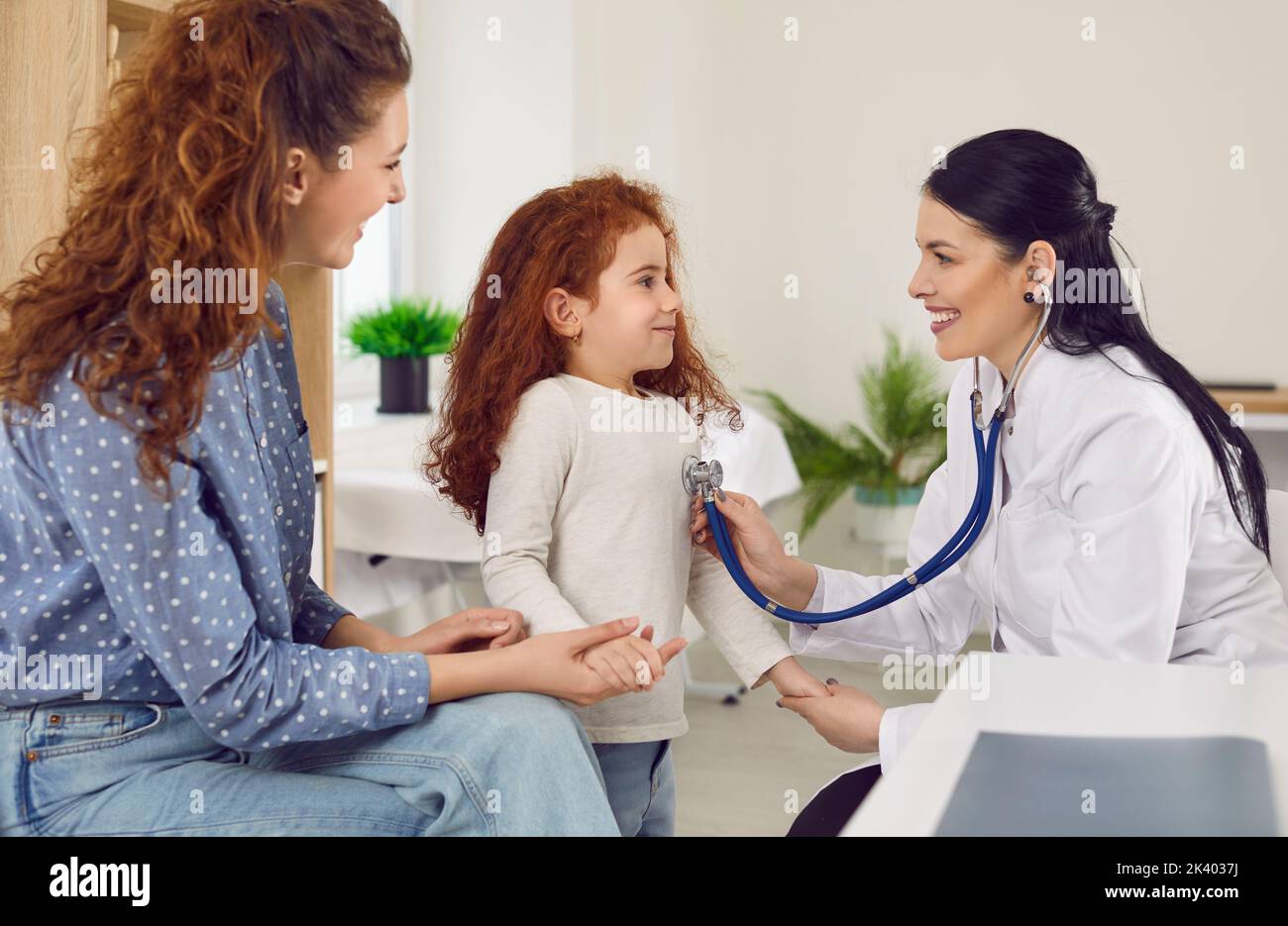 Happy Caucasian woman mom with daughter are at reception of family ...